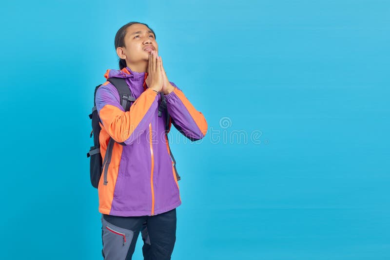 Portrait of Asian Young Man Begging for Something and Holding Hands on ...