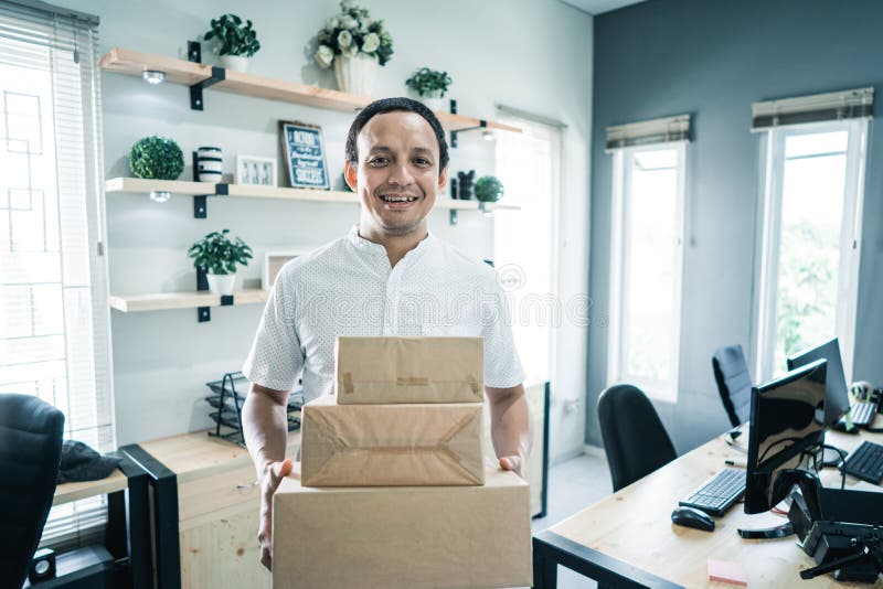 Portrait of Asian Young Man Carrying Packages Stock Photo - Image of ...