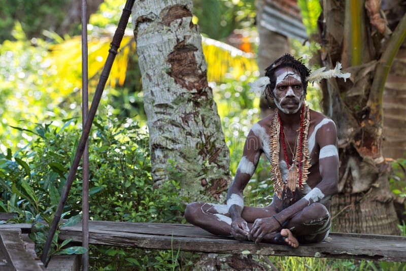 Asmat Men Paddling in Their Dugout Canoe Editorial Photography - Image ...