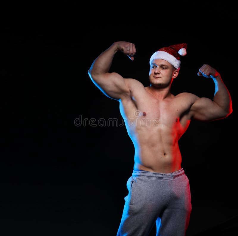 Portrait of an Athlete Bodybuilder Posing in Cap Santa Claus Stock ...