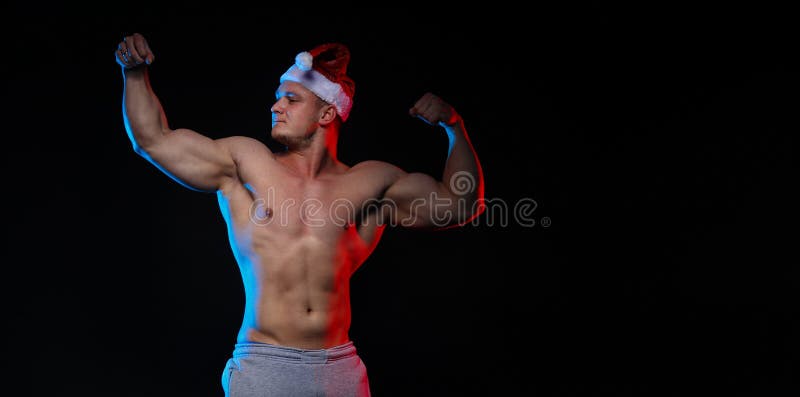 Portrait of an Athlete Bodybuilder Posing in Cap Santa Claus Stock ...