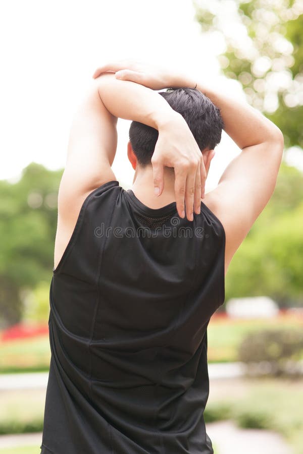 Portrait of Athletic Man Stretching in the Morning and Watching Nice ...