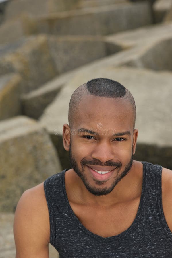 Portrait of an Attractive Black Man Smiling Outdoors Stock Photo ...