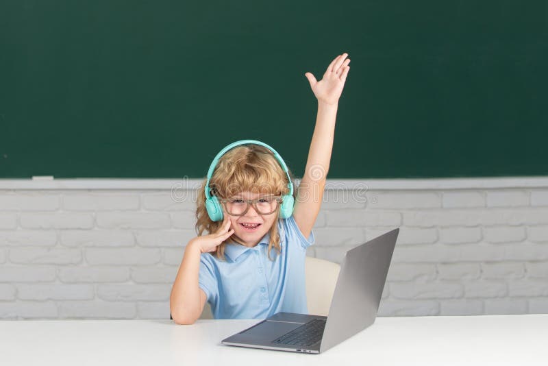 Portrait of Attractive Cheerful Boy with Raised Hand Using Laptop ...