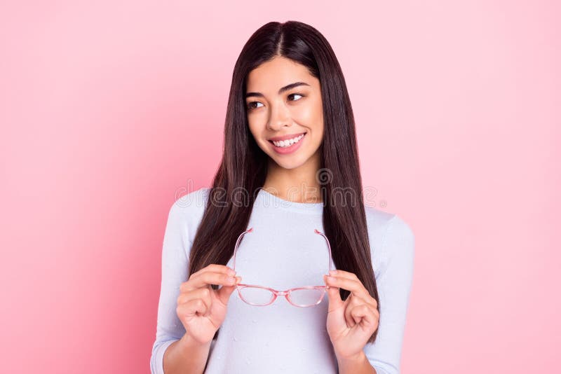 Portrait Of Attractive Cheerful Intellectual Girl Holding In Hands