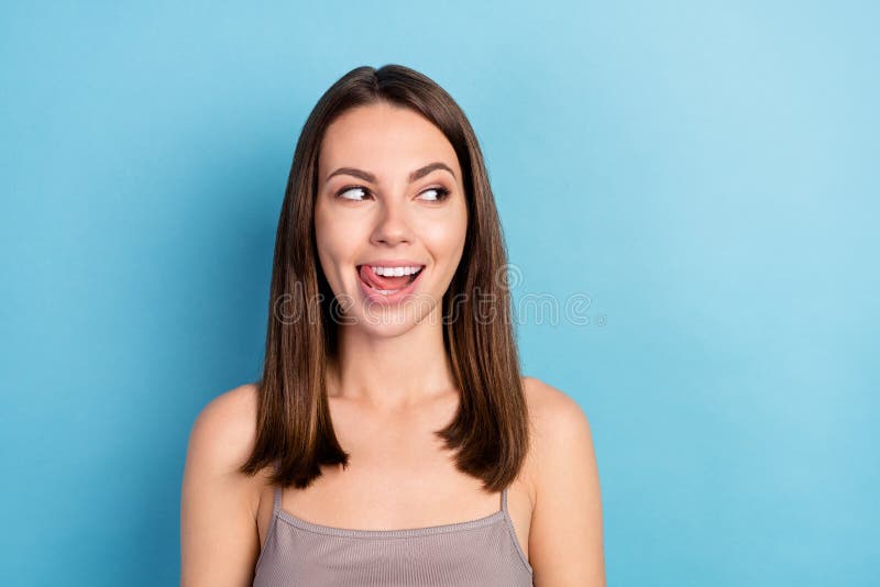 Portrait Of Attractive Curious Cheerful Girl Licking Lip Looking Aside