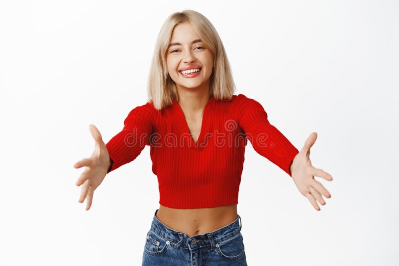 Portrait Of Attractive Female Model In Crop Top Stretching Out Arms At Camera For Hug Hugging