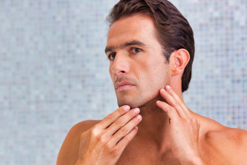 Portrait of Attractive Man Checking His Face in the Mirror Stock Image ...