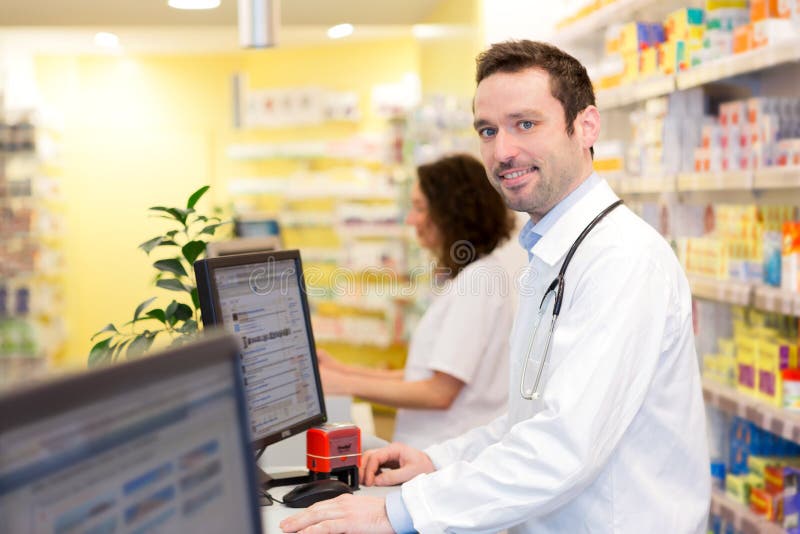 Portrait of an Attractive Pharmacist Team at Work Stock Image - Image ...