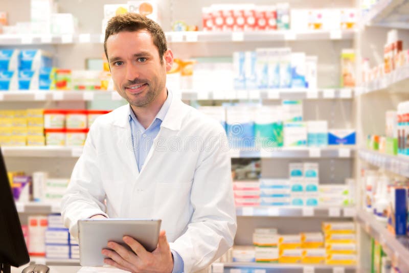 Portrait of an Attractive Pharmacist at Work Stock Image - Image of ...