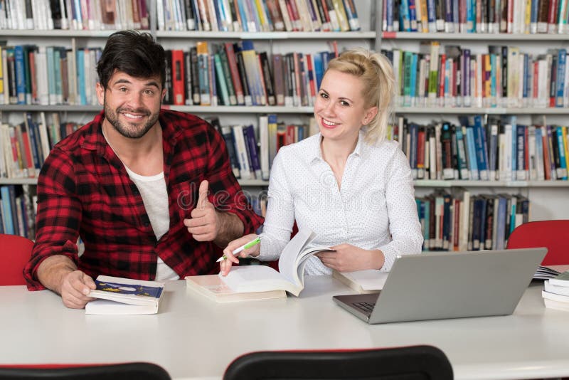 Couple of Students with Laptop in Library Stock Image - Image of laptop ...