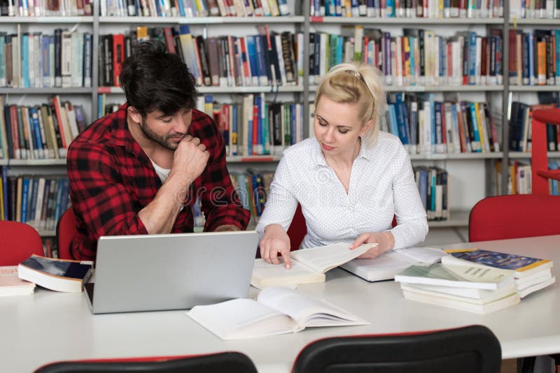 Happy Students Working with Laptop in Library Stock Photo - Image of ...