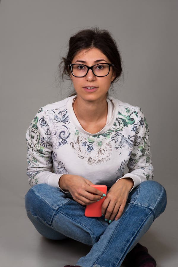 Attractive Pensive Woman Sitting on Grey Background Stock Image - Image ... Attractive Pensive Woman Sitting on Grey Background Stock Image - Image ...