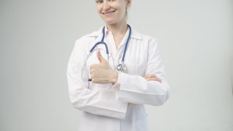 Portrait Of An Attractive Young Female Doctor In White Coat Stock