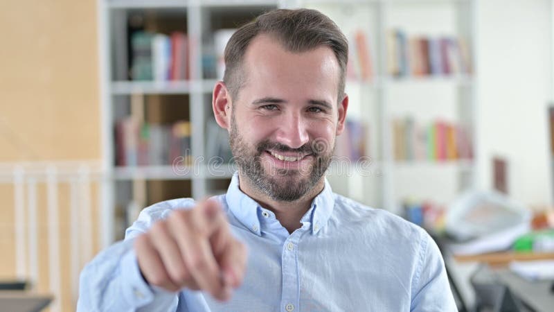 Portrait of Attractive Young Man Pointing with Finger Stock Photo ...