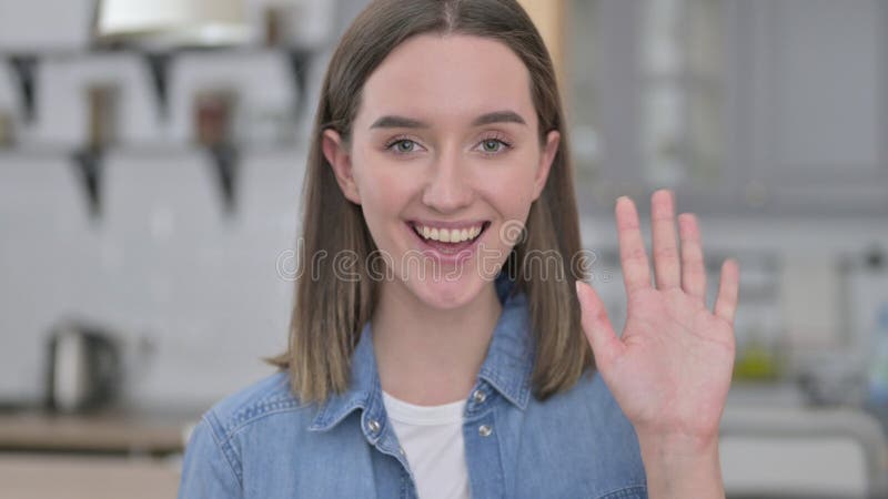 Portrait of Attractive Young Woman Waving at the Camera Stock Image ...
