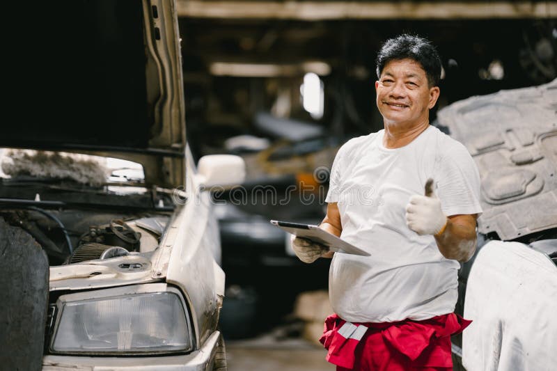 Portrait Auto Mechanic in Garage Car Service Workshop. Happy Smiling ...
