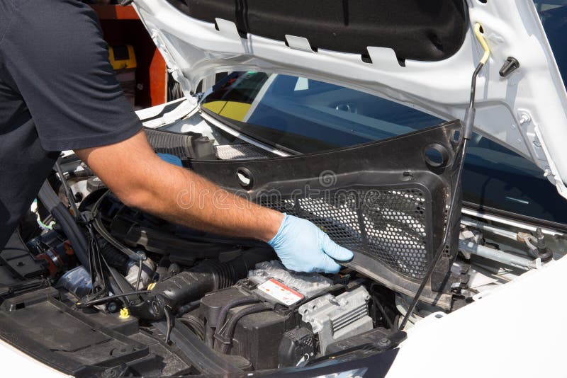 Portrait of an Auto Mechanic at Work on a Car in His Garage Stock Image ...