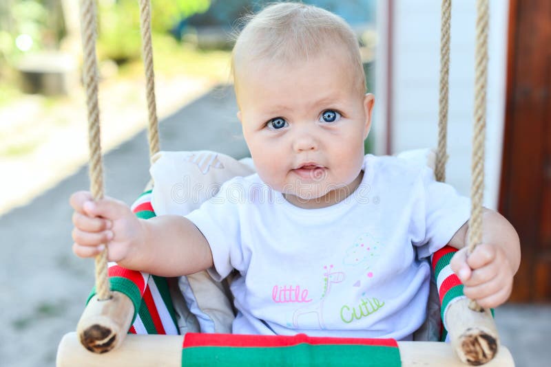 Portrait of Baby with in Backyard Swing Stock Image - Image of ...