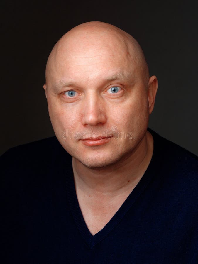 Portrait of a Bald Cheerful Man in Profile on a Black Background Stock ...