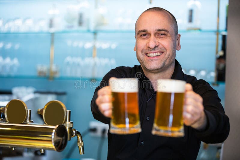 Portrait of Bar Tender Offering Beer Stock Photo - Image of cafe ...