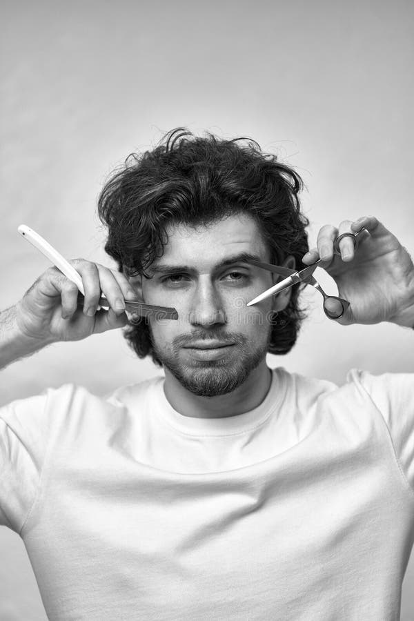 Barber Testing the Sharpness of Blade before Cutting Stock Photo ...
