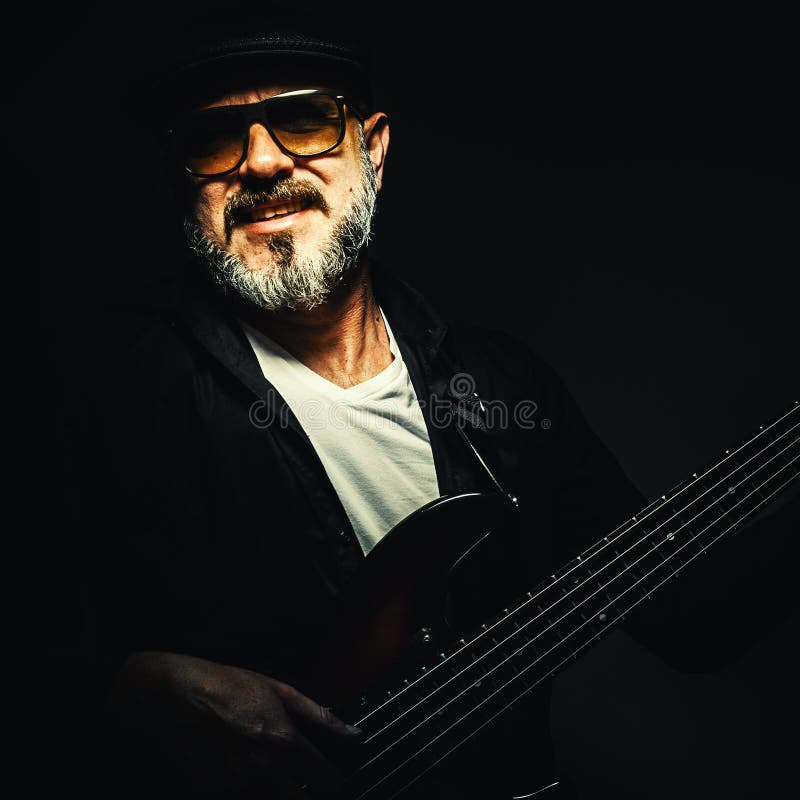 Portrait of a Bass Player stock image. Image of expression - 68451267
