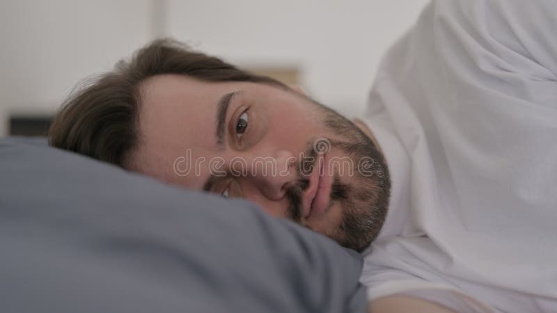 Portrait of Young Man Awake in Bed Thinking Stock Image - Image of ...