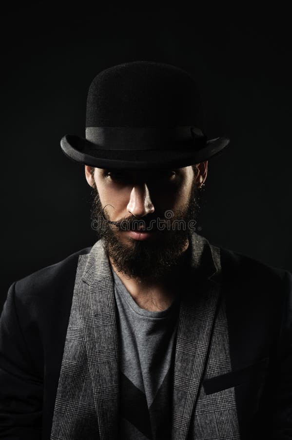 The Bearded Man in a Fitted Hat is Standing, Fists Clenched Stock Photo ...