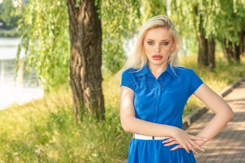 Portrait Of A Beautiful Blonde Girl Outdoors In Summer Stock Image