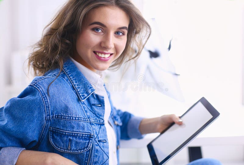 Portrait Of Beautiful Business Woman Working At Her Desk With Headset