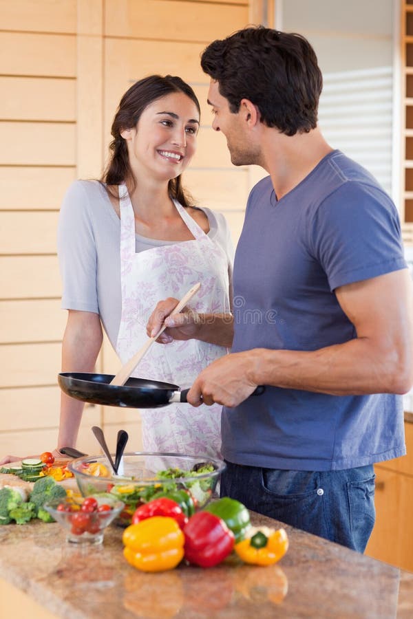 Portrait of a Beautiful Couple Cooking with a Pan Stock Image - Image ...