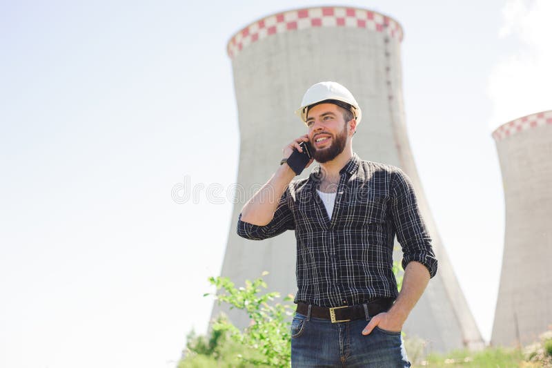 Portrait of a Beautiful Engineer at Work with the Phone. Stock Image ...