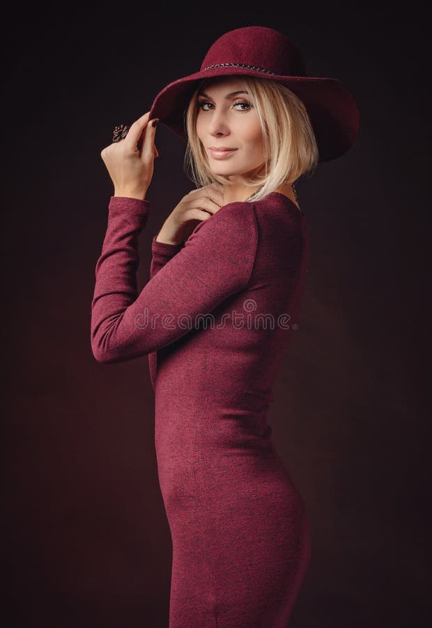 Portrait of Beautiful Female in Red Clothing Looking at the Camera ...