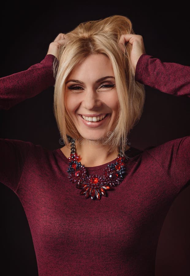 Portrait of Beautiful Female in Red Clothing Looking at the Camera ...