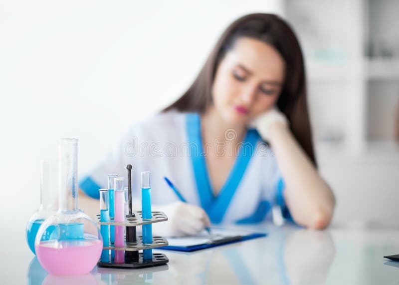 Portrait of Beautiful Female Scientist Writing Notes Stock Photo ...