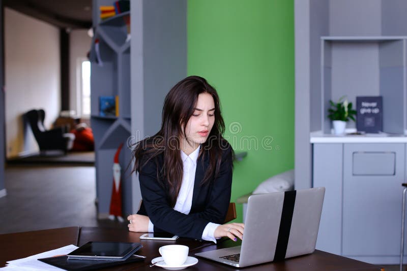 Portrait Of Beautiful Female Secretary Who Poses And Looks Away Stock