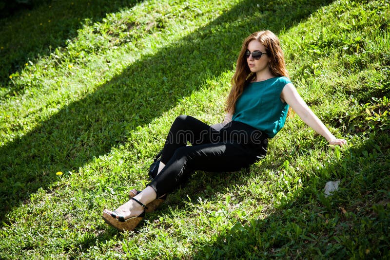 Portrait of a Beautiful Girl Sitting on Grass Stock Photo - Image of ...