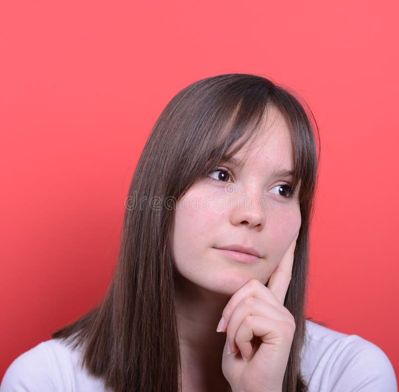 Portrait of Beautiful Girl Thinking Against Red Background Stock Image ...