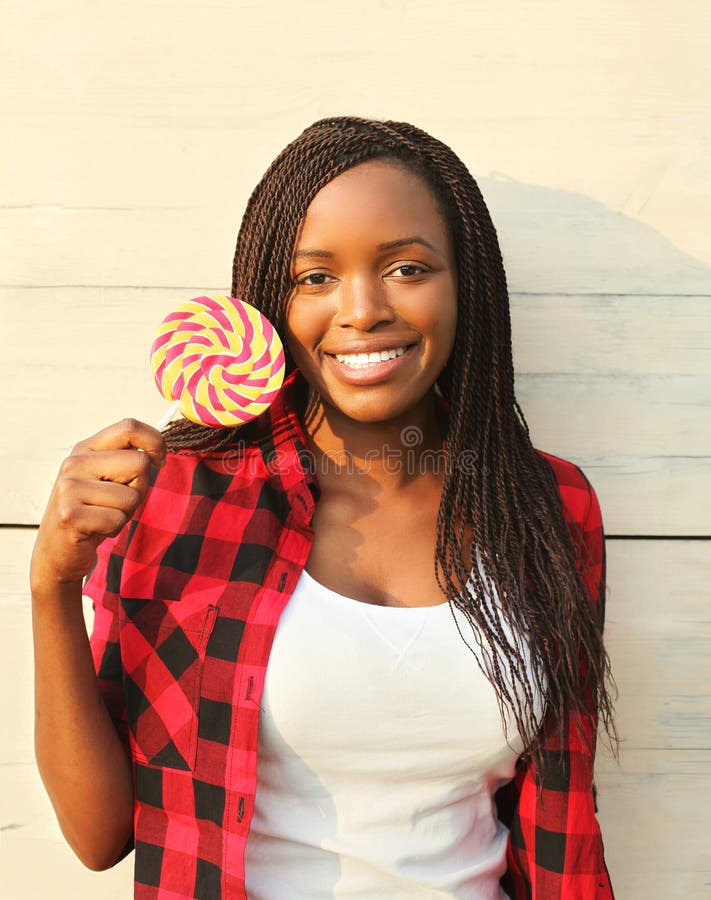 Portrait Beautiful Happy Smiling African Woman With Sweet Lollipop