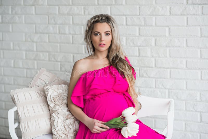 Portrait Of A Beautiful Pregnant Woman Bright Dress And Long Hair Stock