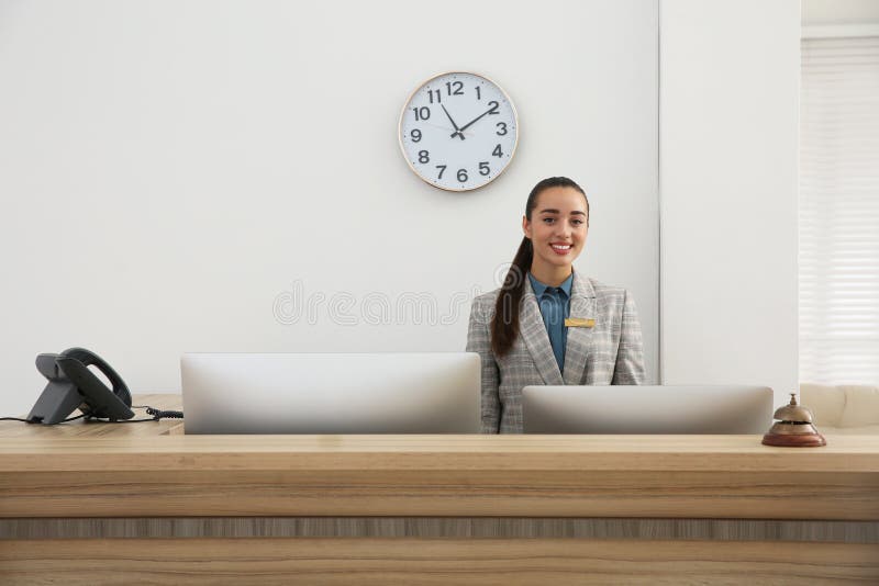 Portrait of Beautiful Receptionist at Counter in Hotel Stock Image ...