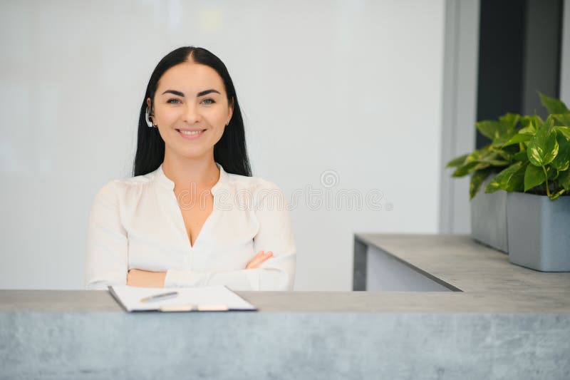 Portrait of Beautiful Receptionist Near Counter in Hotel Stock Photo ...