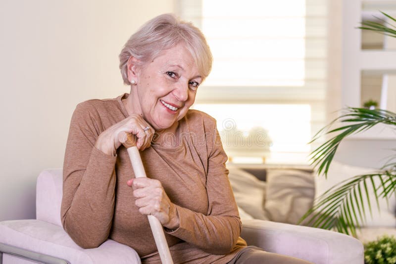 Portrait Of Beautiful Senior Woman With White Hair And Walking Stick