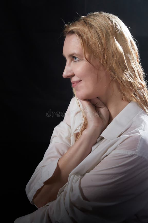 Portrait Of Beautiful Skinny Girl With Wet Long Blonde Hair In A Dark