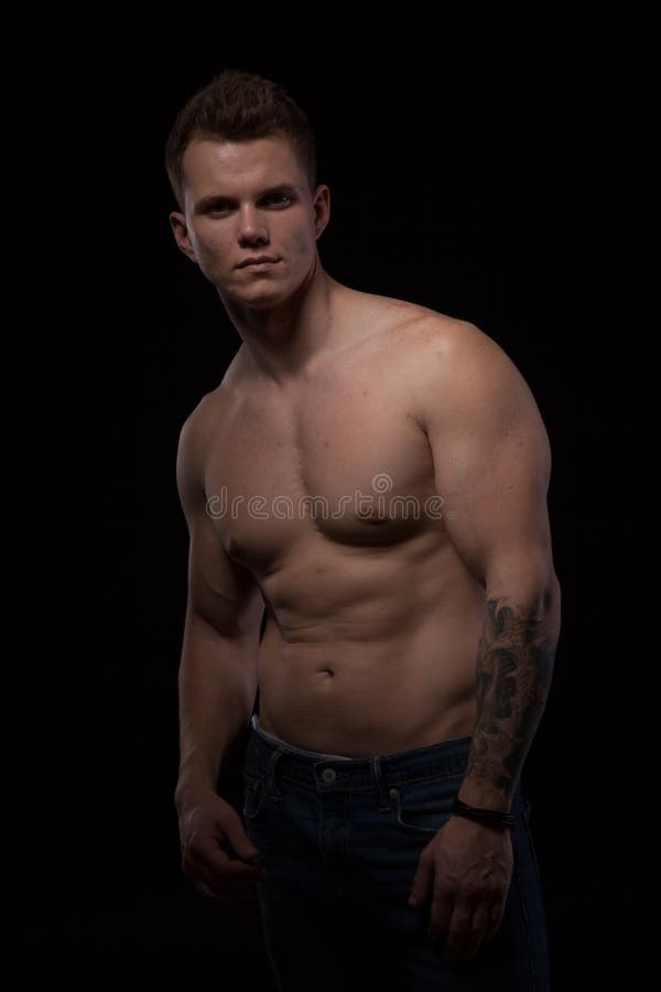 A Handsome Strong Young Man Talks on a Smartphone Business Stock Photo ...