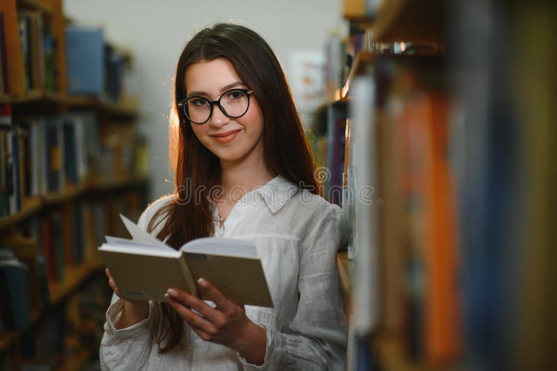 Portrait of a Beautiful Student in a Library Stock Image - Image of ...