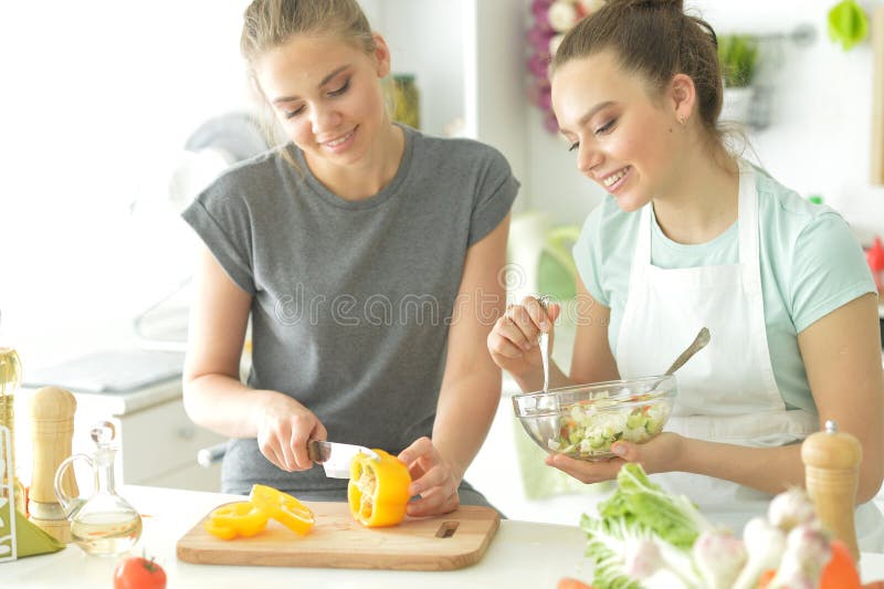 Portrait of a Beautiful Teenagers Cooking in Kitchen Stock Photo ...
