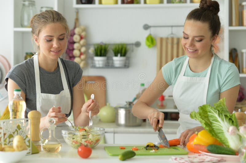Portrait of Beautiful Teenagers Cooking in Kitchen Stock Photo - Image ...