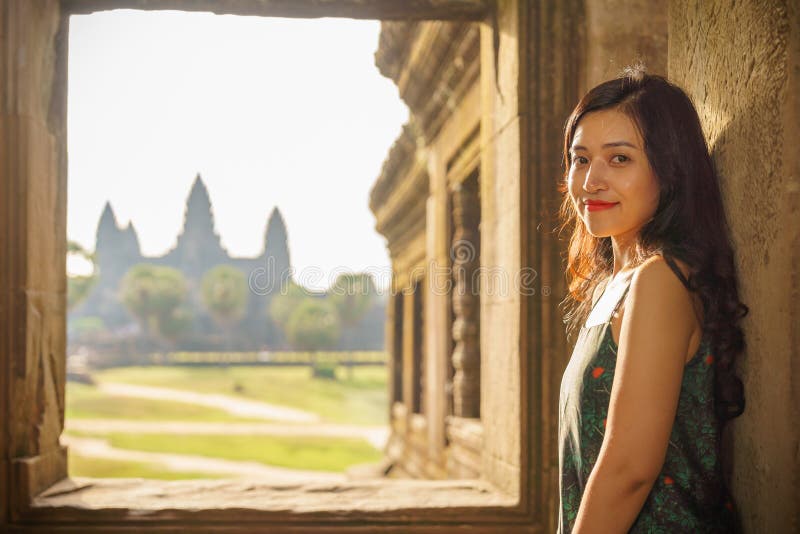 Portrait Of Beautiful Vietnamese Millennial Girl Posing Next To Angkor
